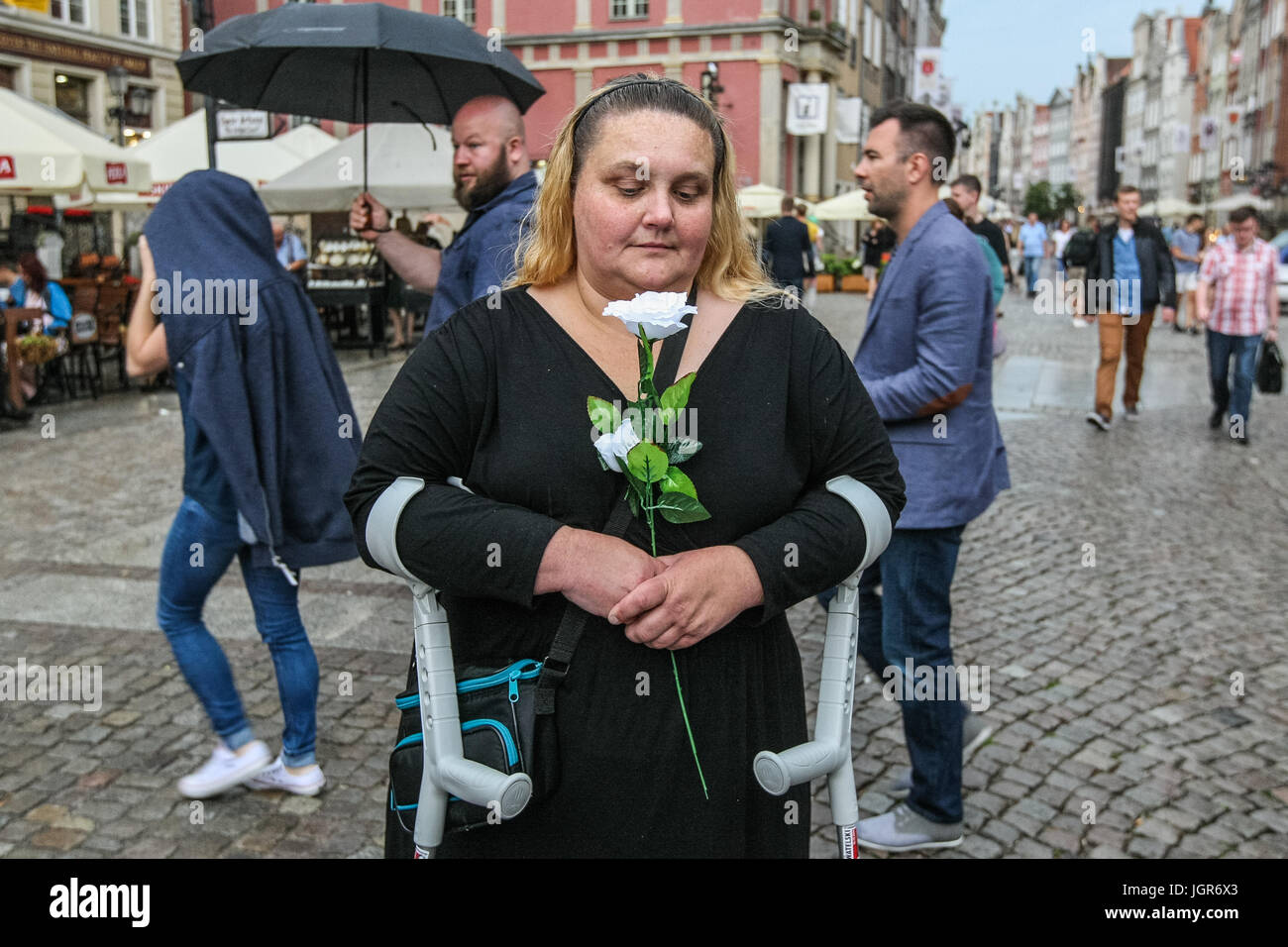 Gdansk, Poland. 10th July, 2017. Protesters holding white roses are ...