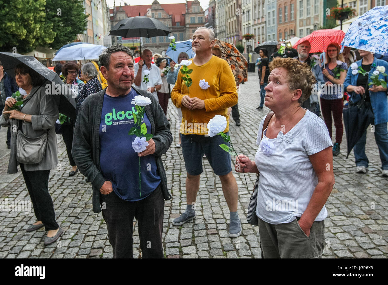 Gdansk, Poland. 10th July, 2017. Protesters holding white roses are ...