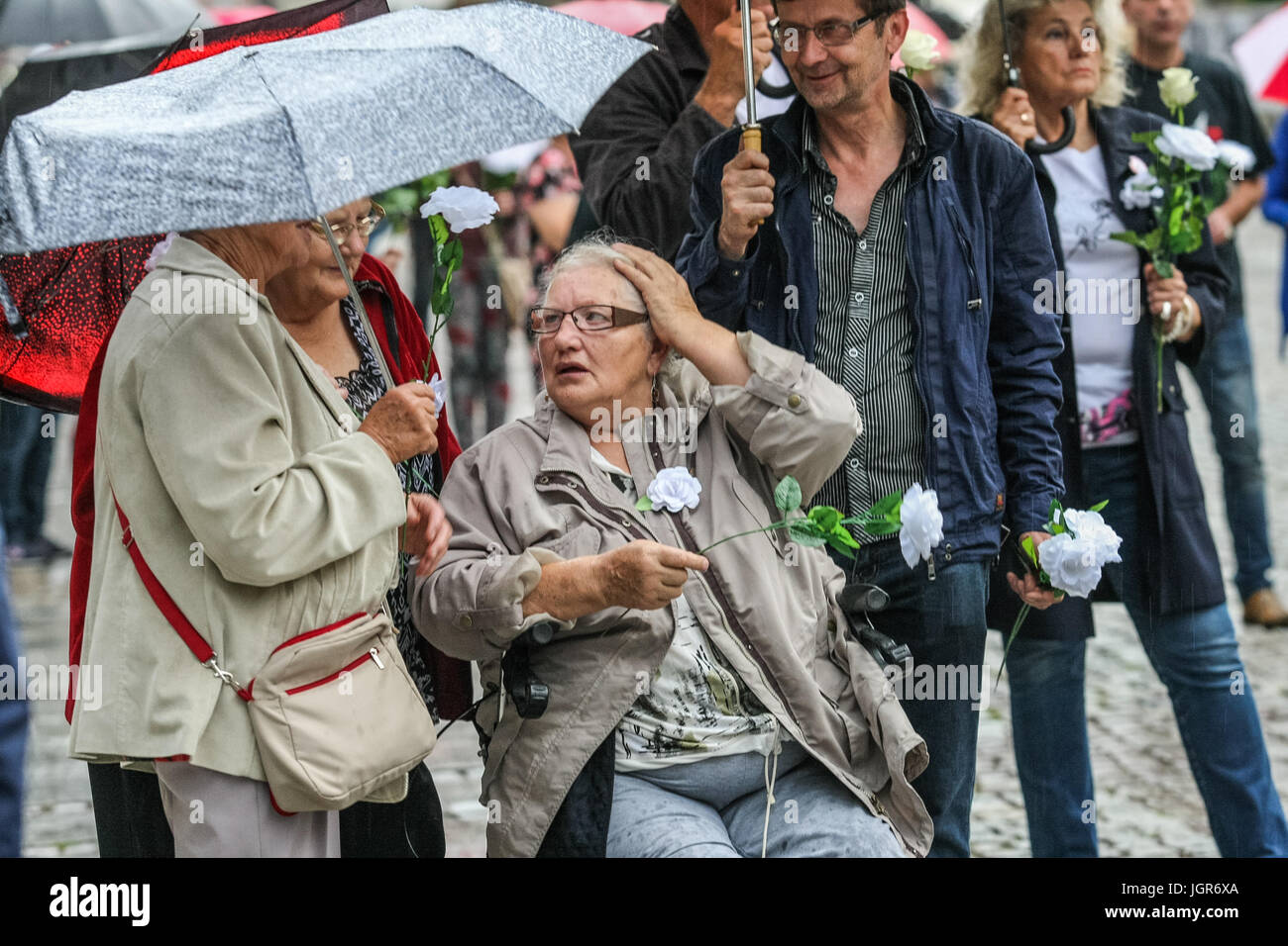 Gdansk, Poland. 10th July, 2017. Protesters holding white roses are ...