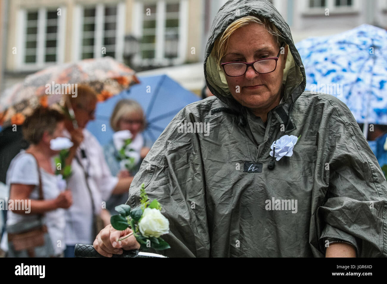 Gdansk, Poland. 10th July, 2017. Protesters holding white roses are ...