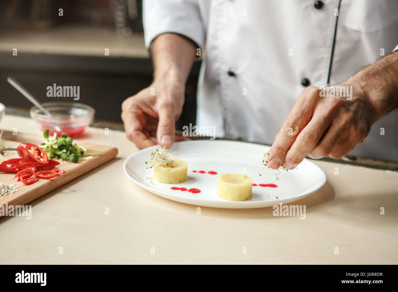 Mature man professional chef cooking meal indoors Stock Photo - Alamy