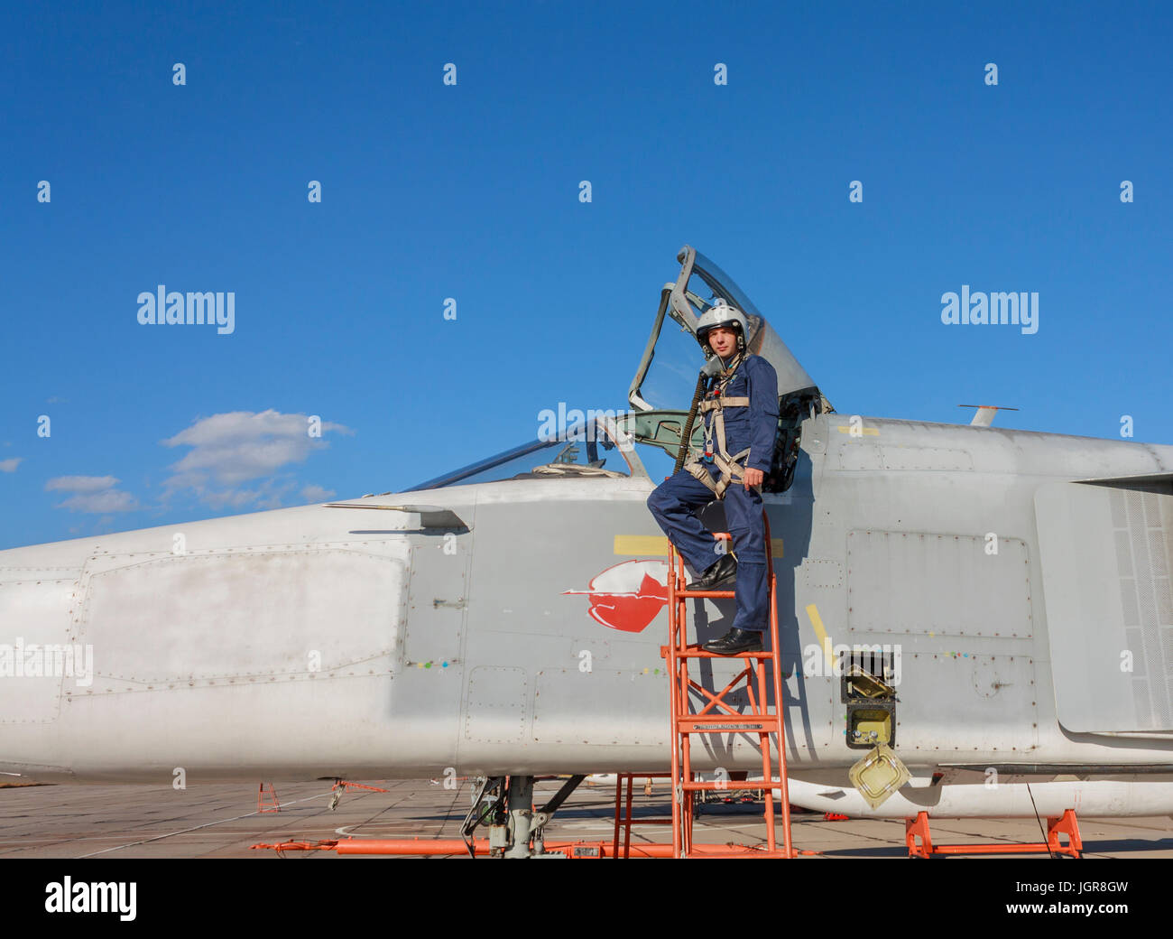 Military pilot in helmet stands near jet plane Stock Photo - Alamy