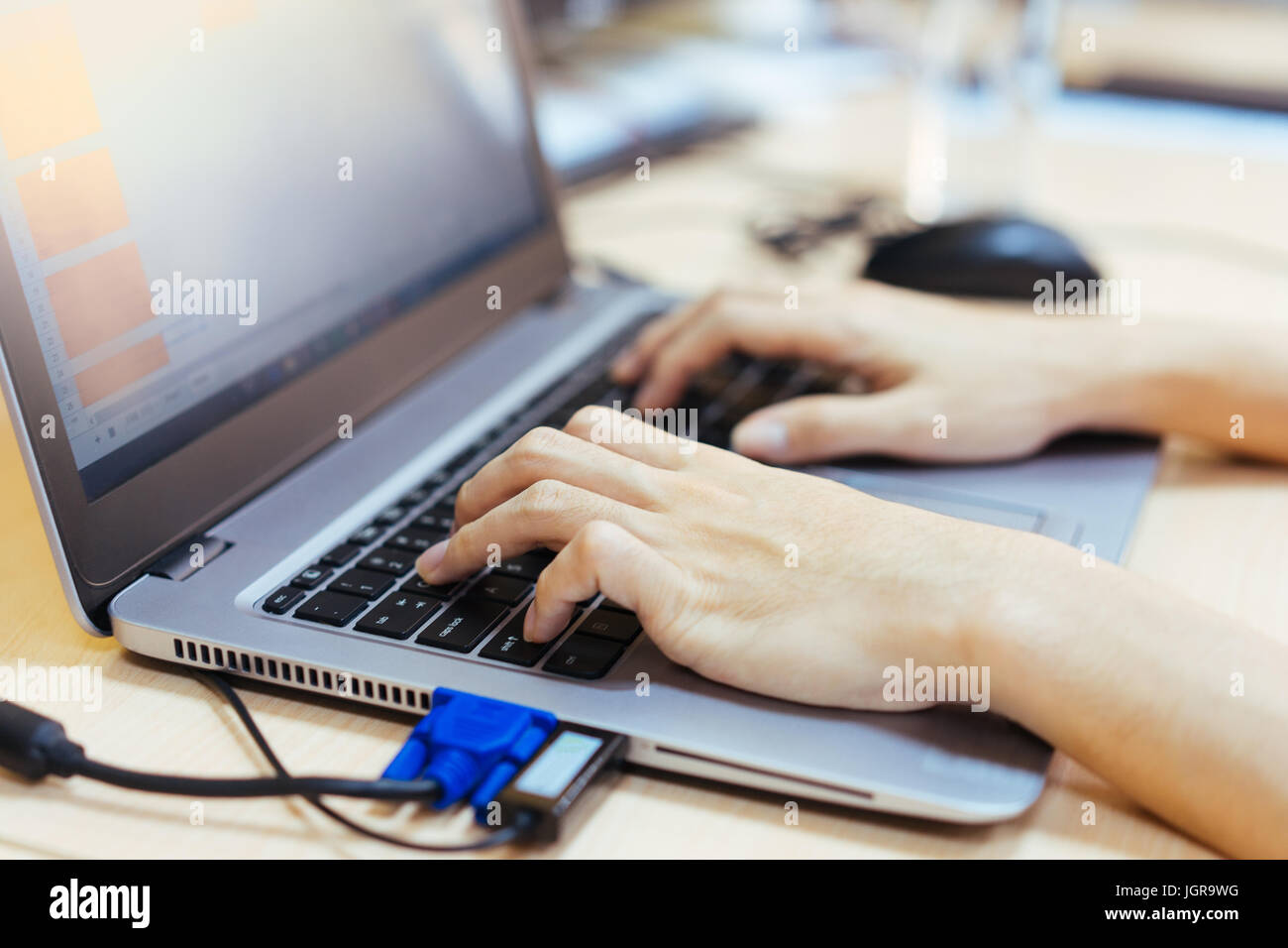Working with laptop Stock Photo - Alamy
