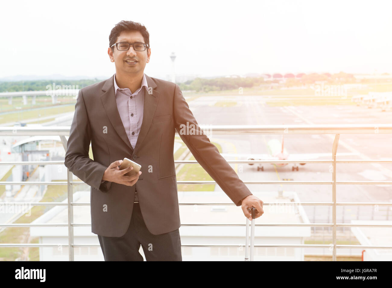 indian male walking at airport Stock Photo - Alamy
