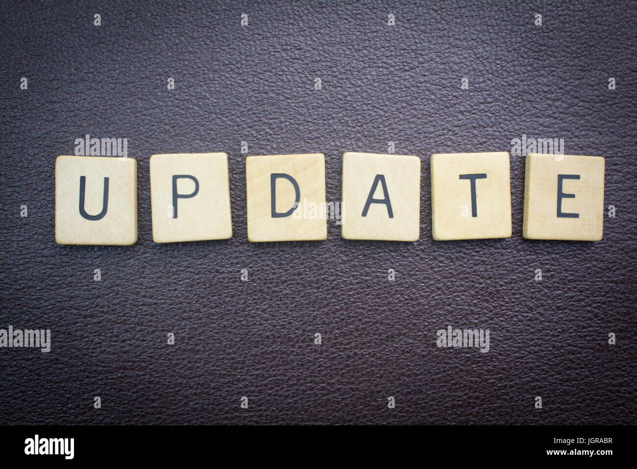 Update word concept for website on dark leather background Stock Photo ...