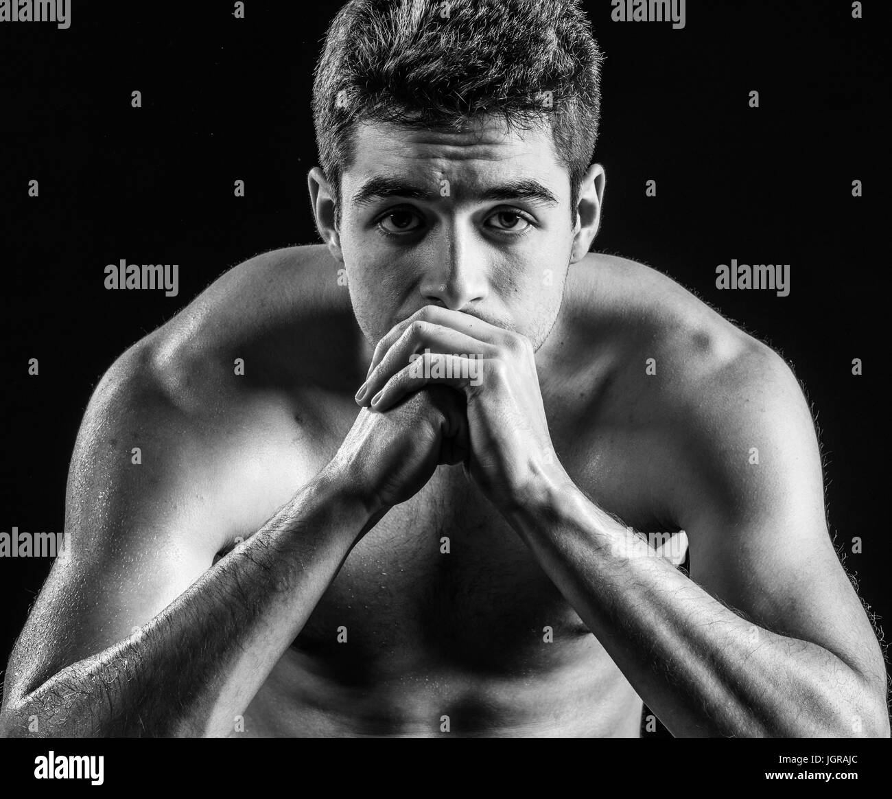 Shirtless muscular man staring into camera seriously Stock Photo - Alamy