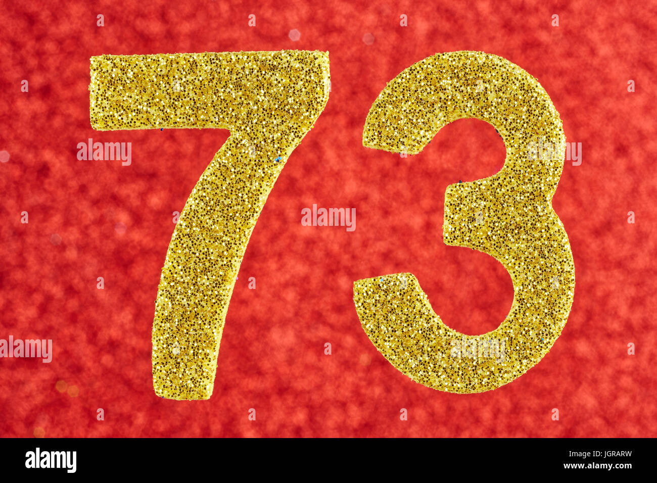 Number seventy-three yellow color over a red background. Anniversary ...