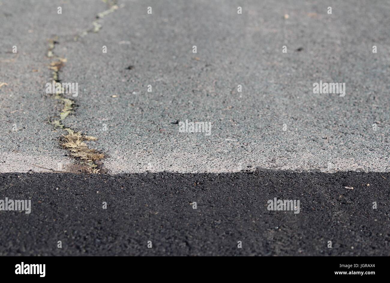 New and old road surface junction Stock Photo - Alamy