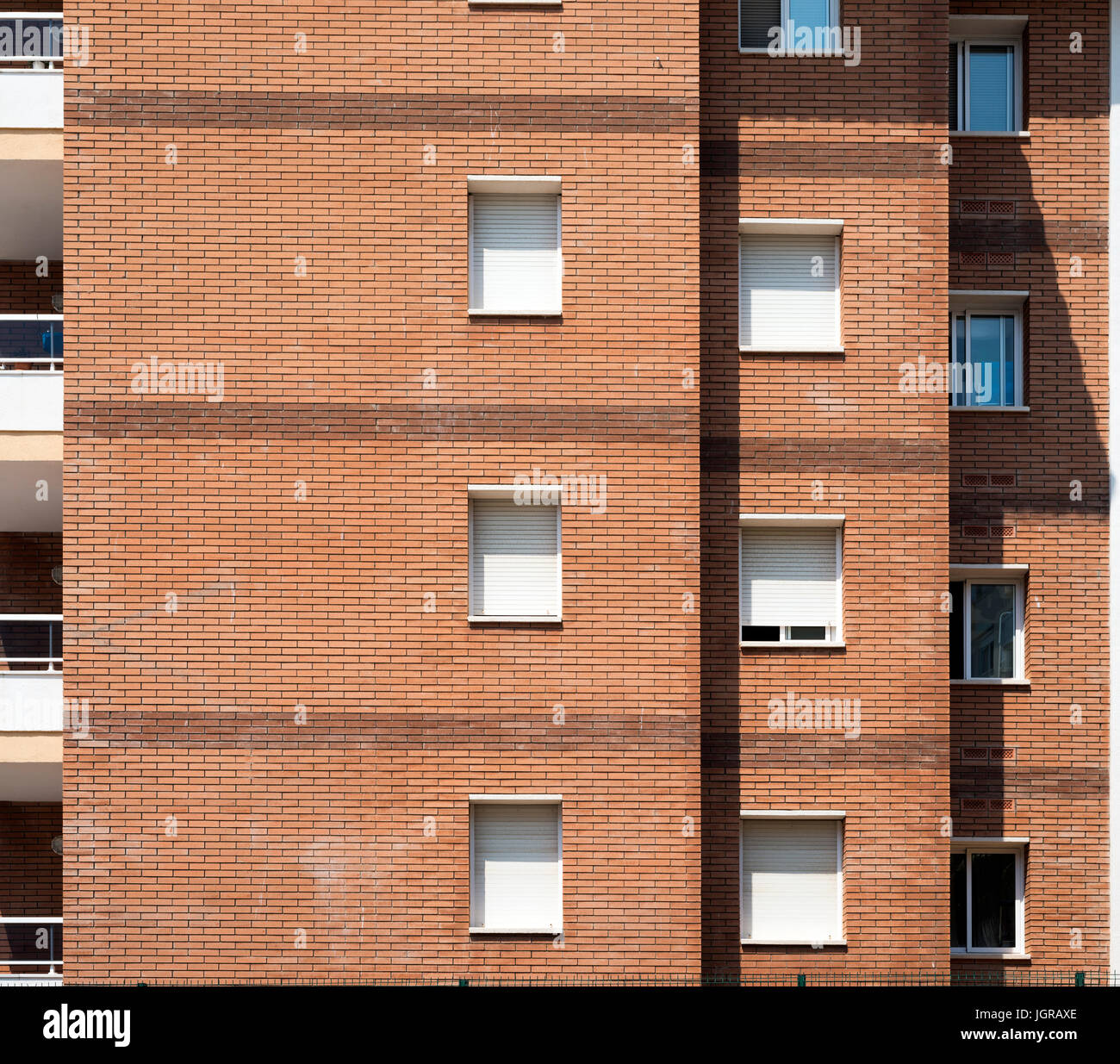 Typical brick multi-storey residential building. Close-up front view ...