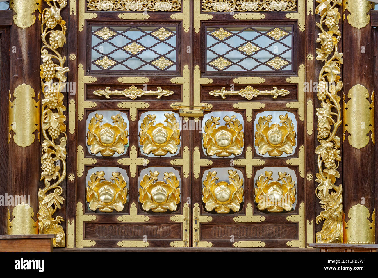 Wooden and golden door Stock Photo - Alamy