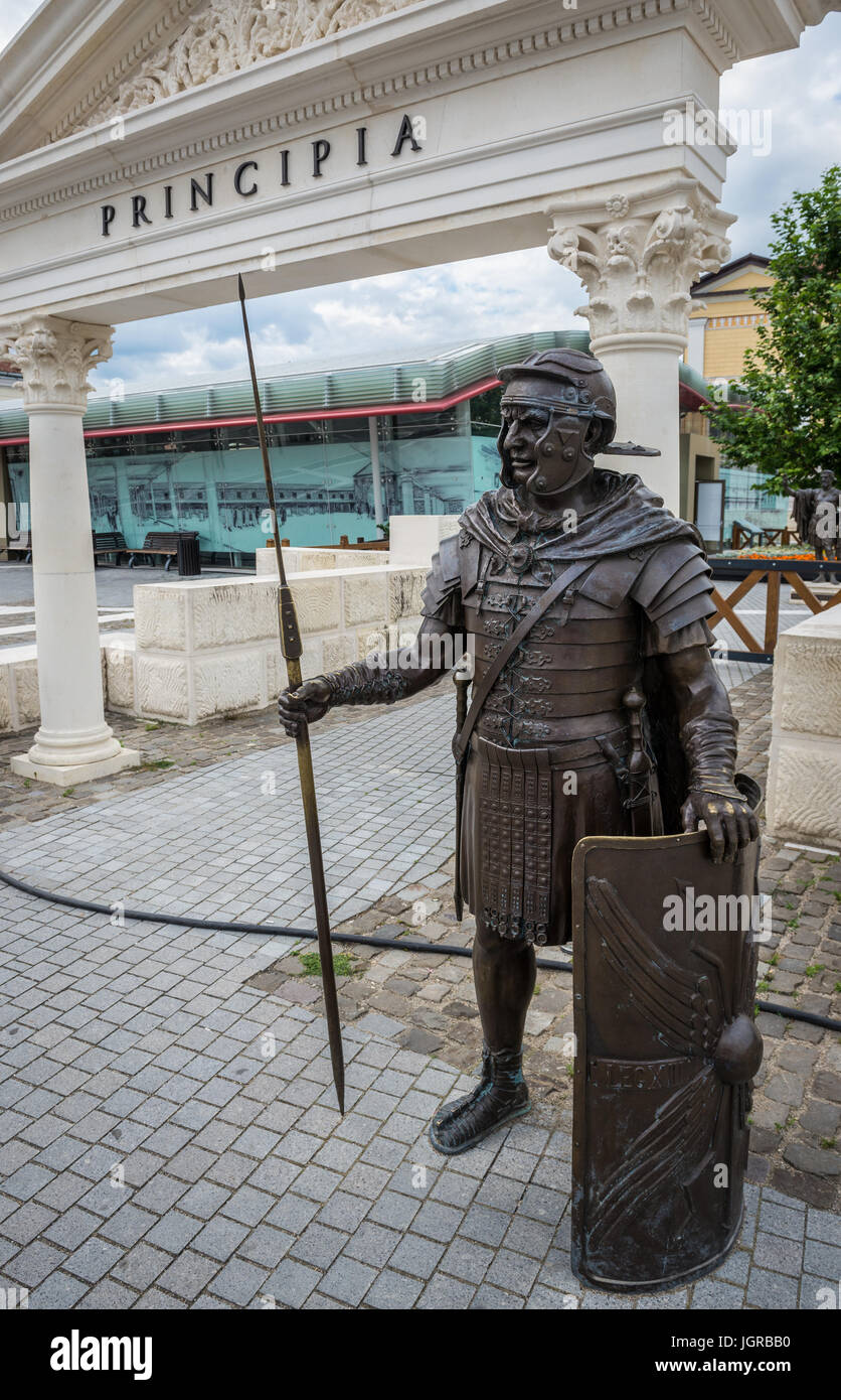 Roman legionary bronze statue in next to Roman ruins in Alba Carolina ...