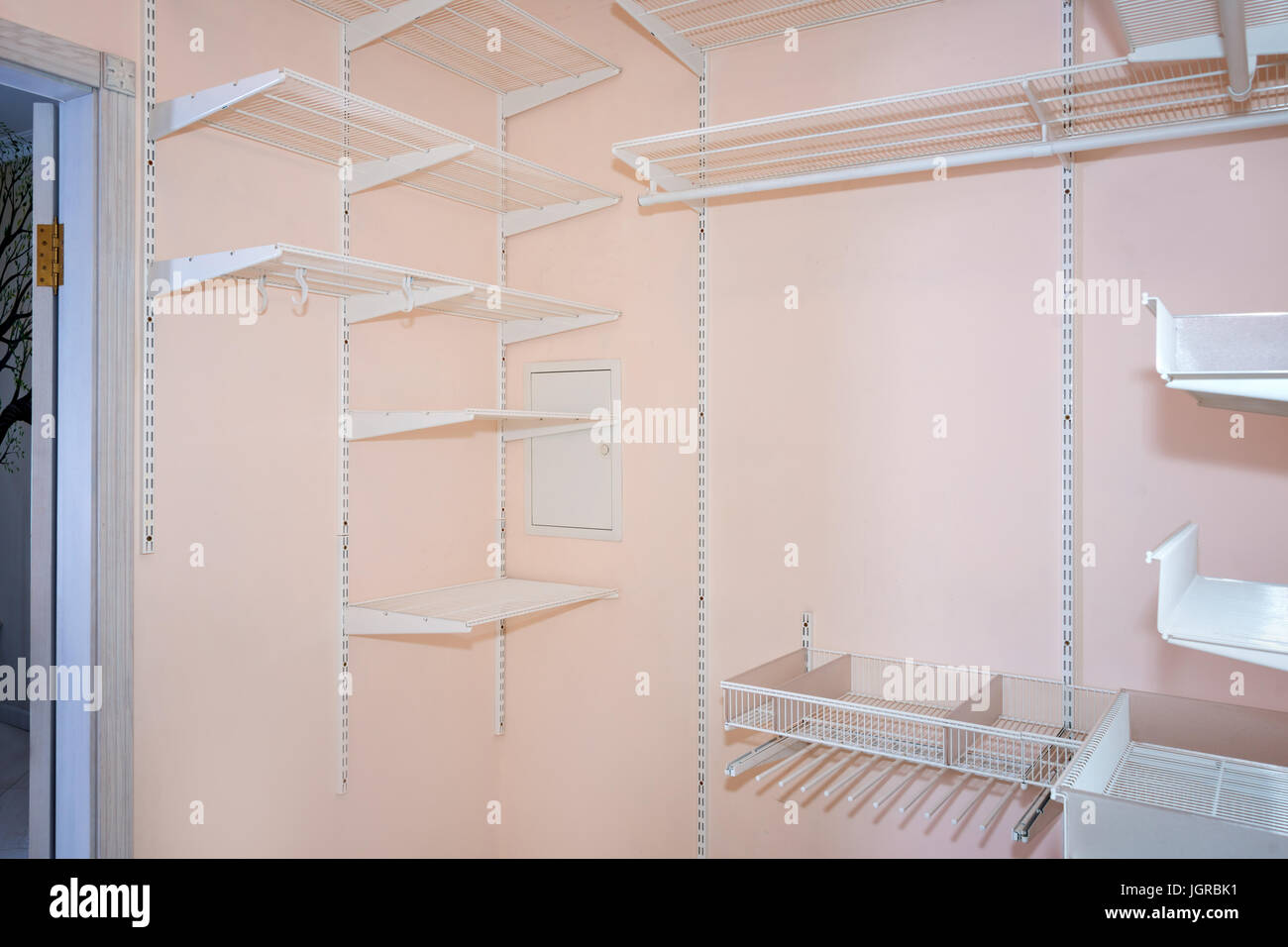 Empty walk-in closet with shelves. Dressing room Interior elements ...