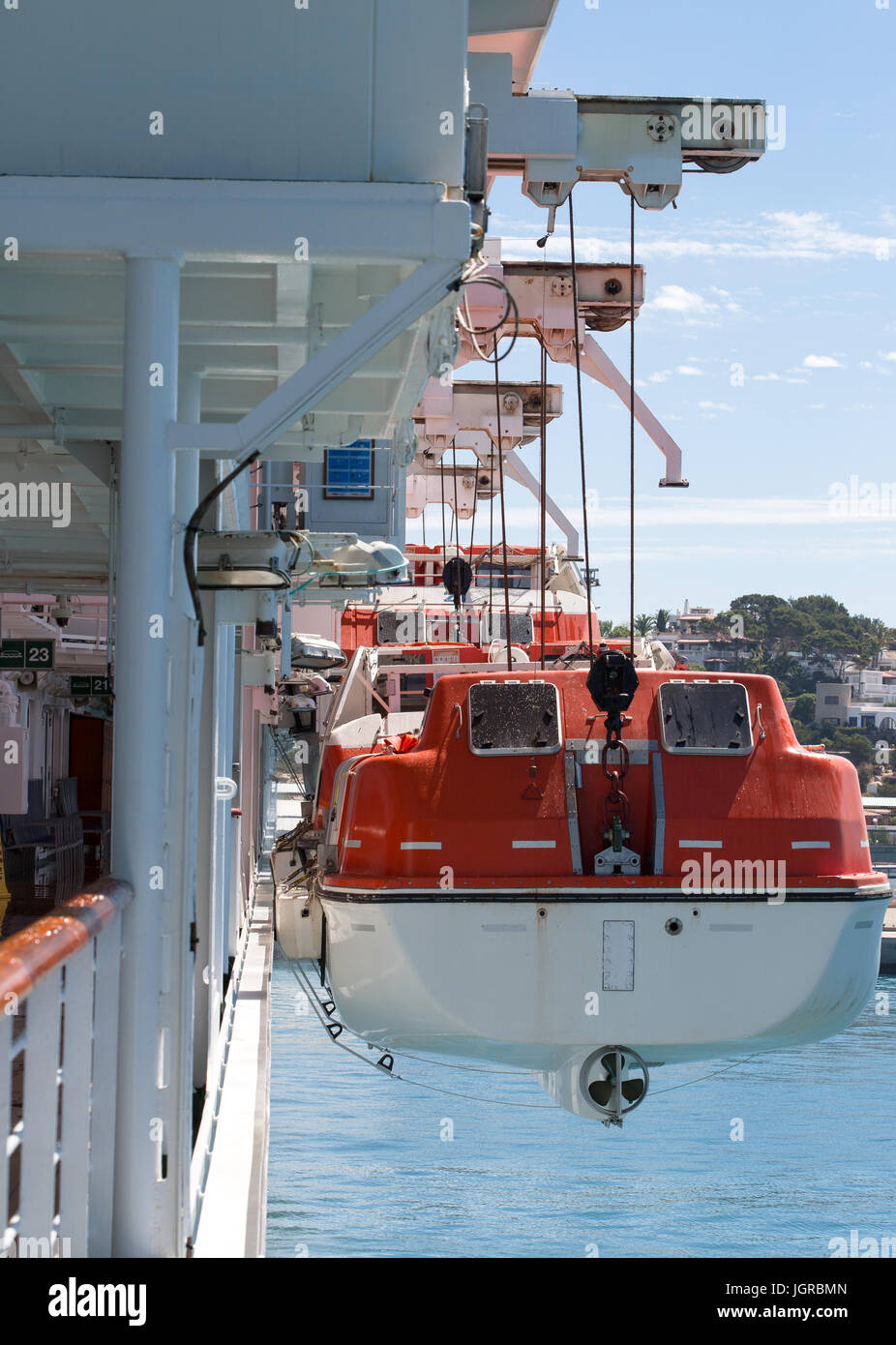 Lifeboat swung out from ship on davits Stock Photo - Alamy