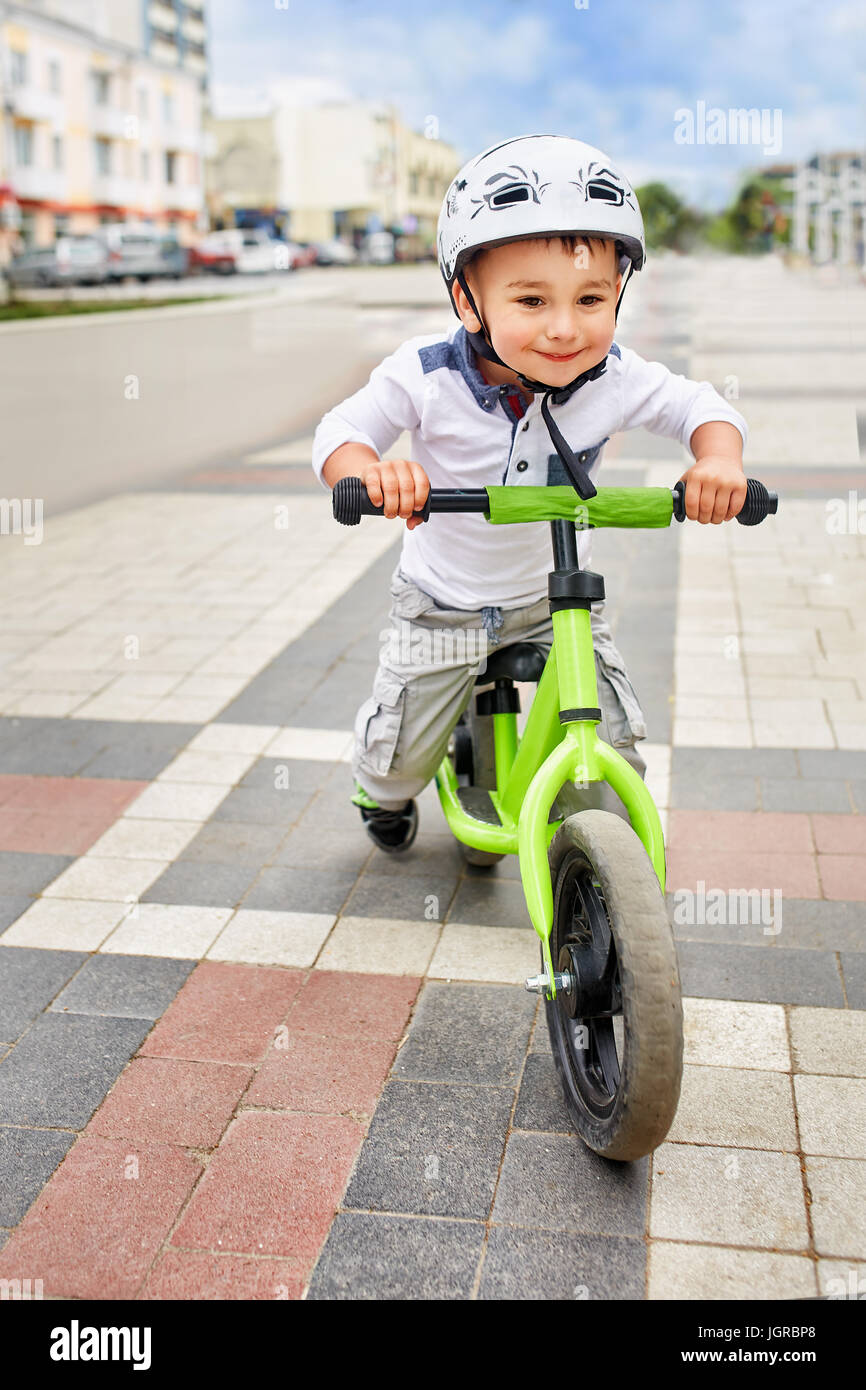 boy in a helmet riding bike Stock Photo - Alamy