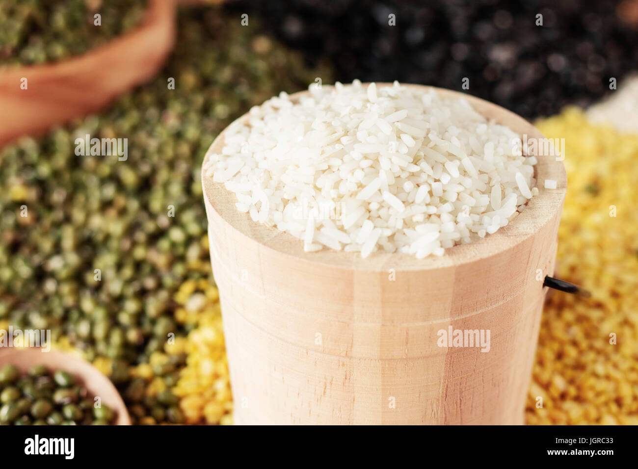 bucket of rice and many nuts on the floor Stock Photo - Alamy