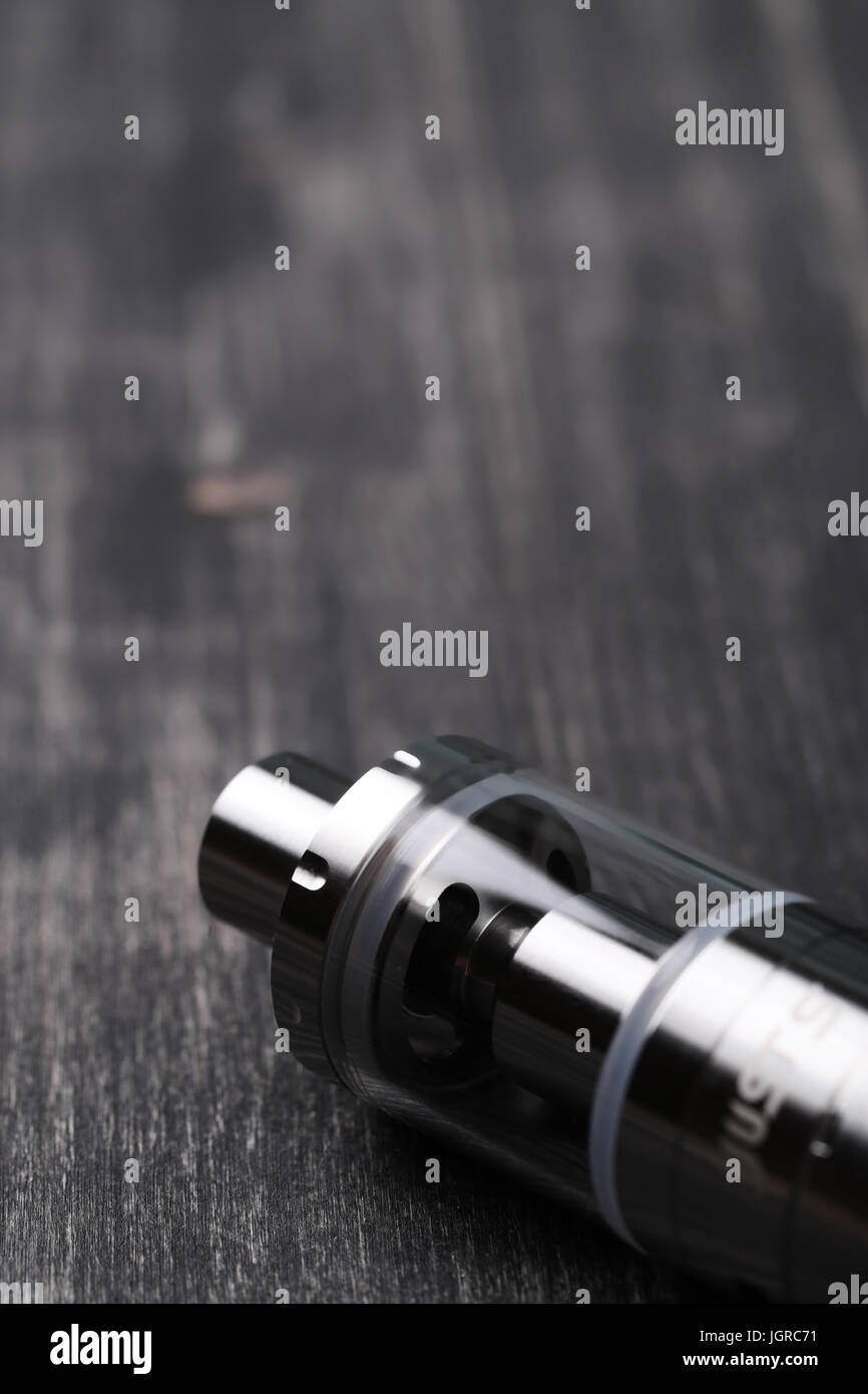 Vaping device on the wooden table Stock Photo - Alamy