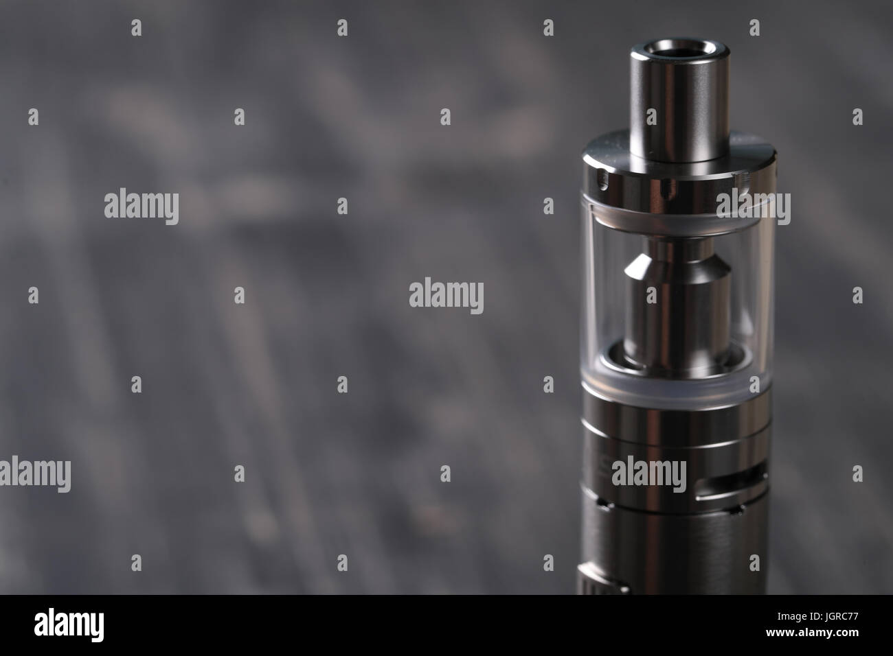 Vaping device on the wooden table Stock Photo - Alamy