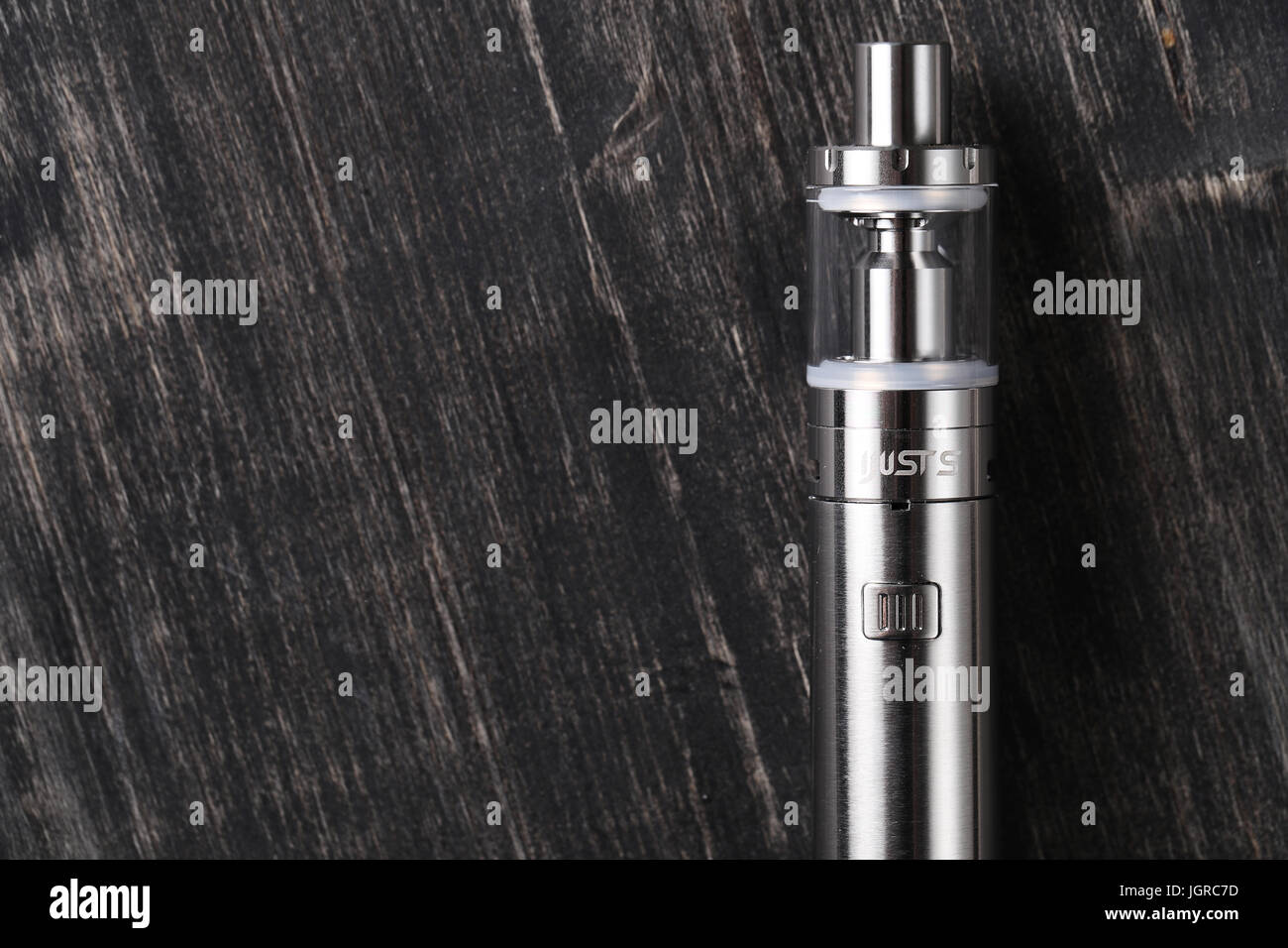 Vaping device on the wooden table Stock Photo - Alamy