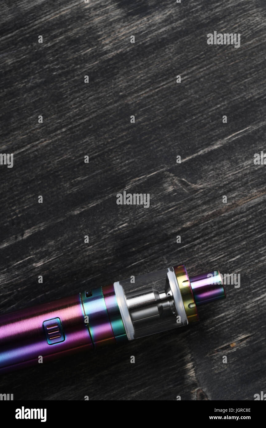 Vaping device on the wooden table Stock Photo - Alamy