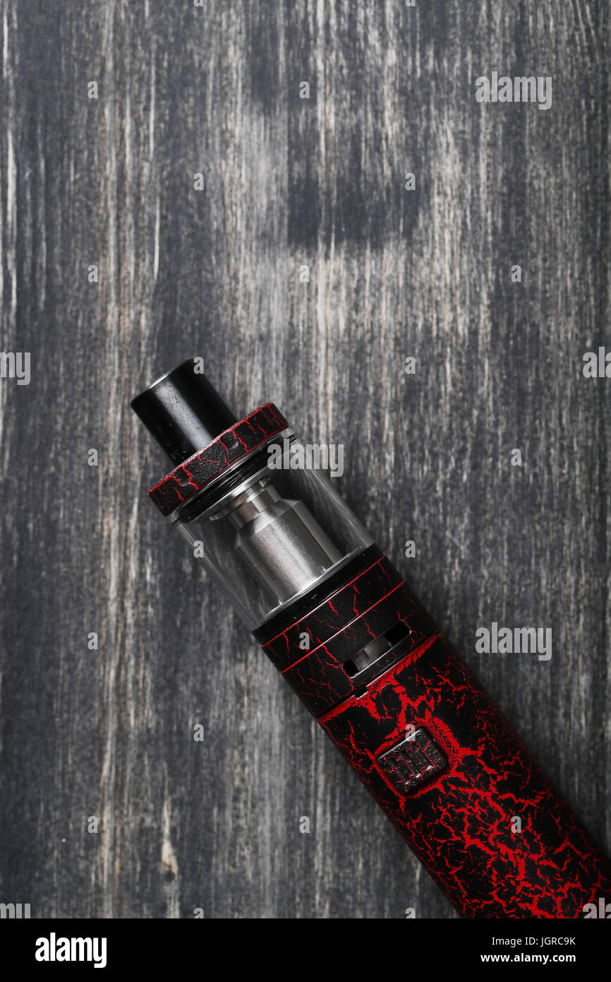 Vaping device on the wooden table Stock Photo - Alamy