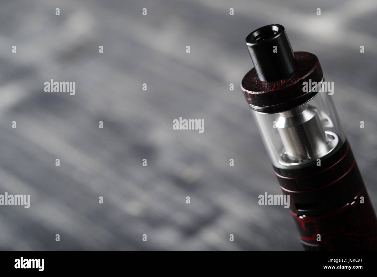 Vaping device on the wooden table Stock Photo - Alamy