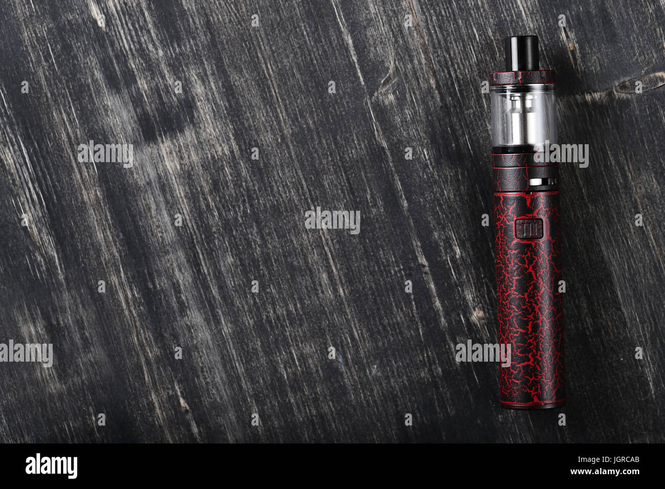 Vaping device on the wooden table Stock Photo - Alamy