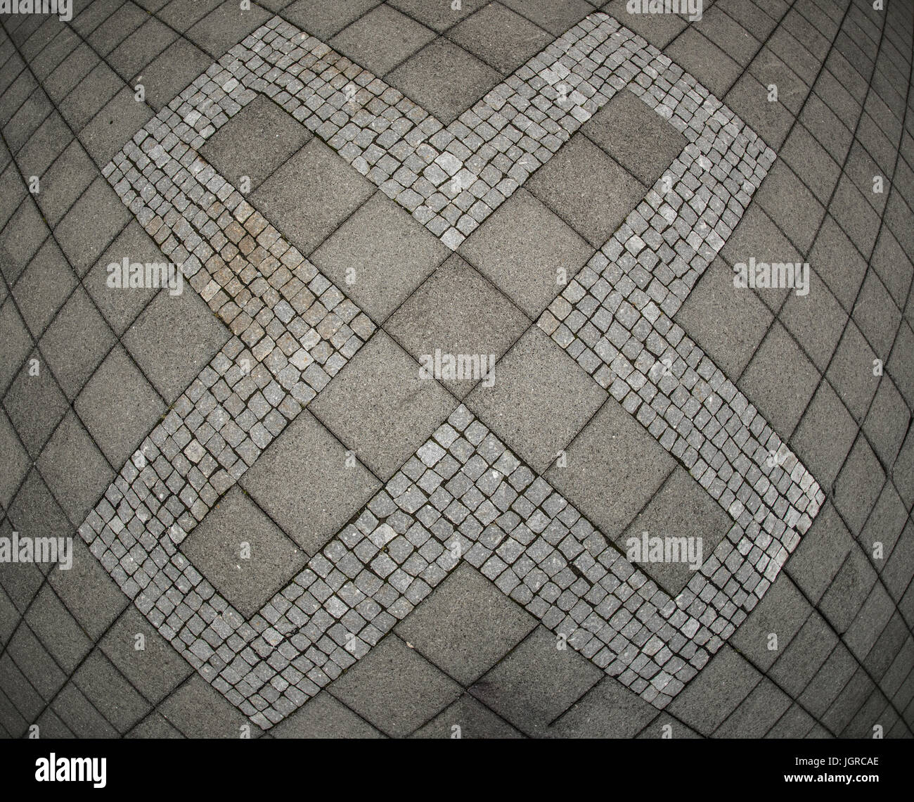Abstract X symbol on concrete tile Stock Photo - Alamy