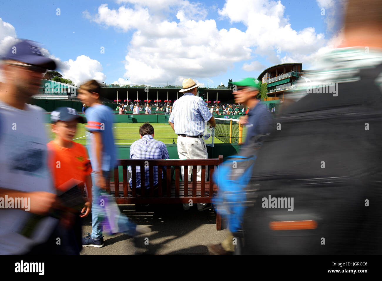 Spectators take their seats at the start of day seven of the Wimbledon ...