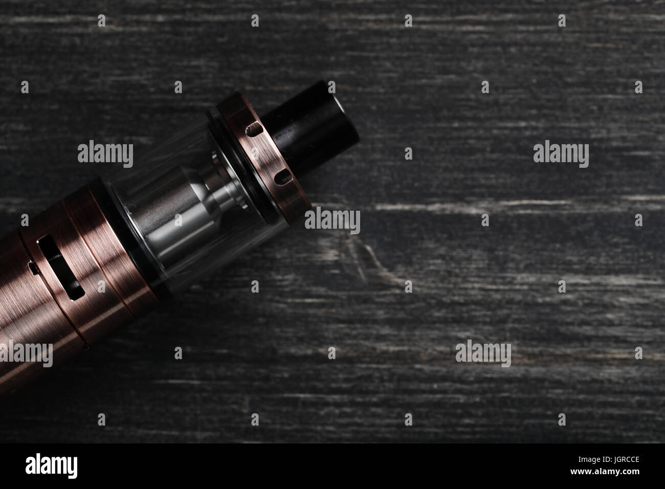 Vaping device on the wooden table Stock Photo - Alamy