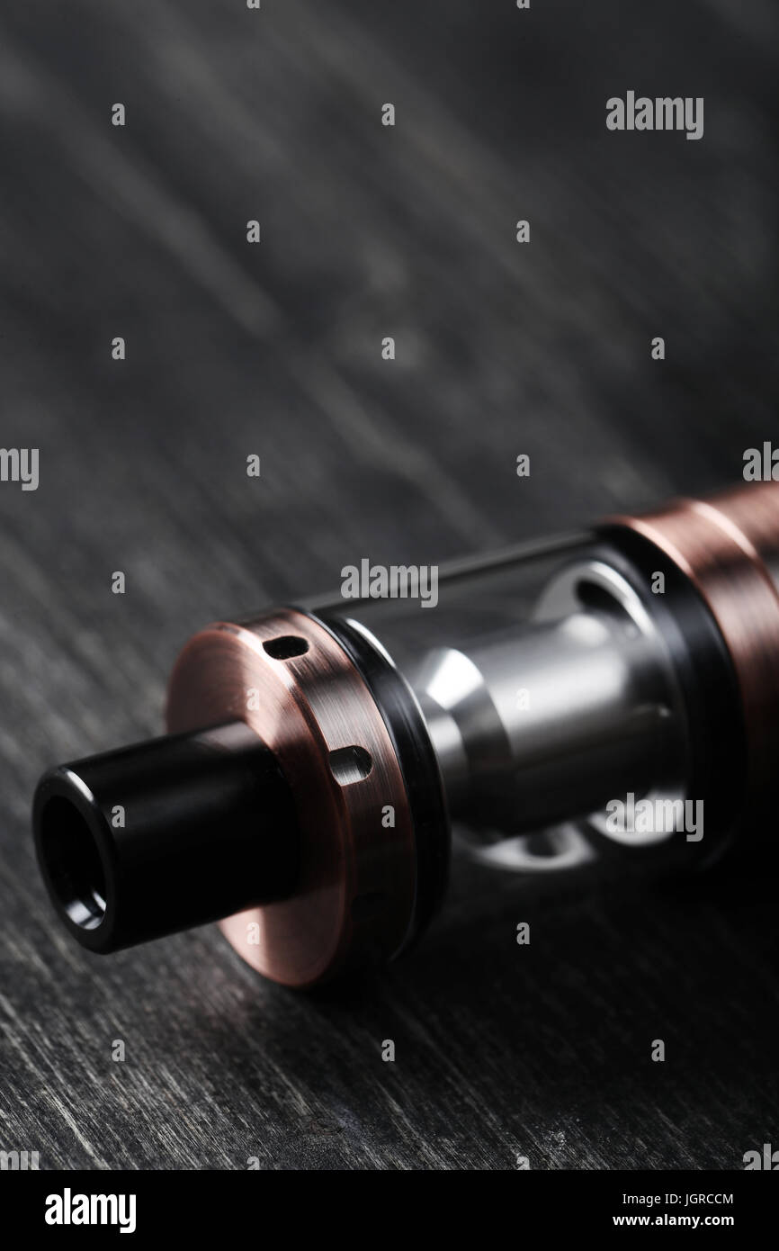 Vaping device on the wooden table Stock Photo - Alamy