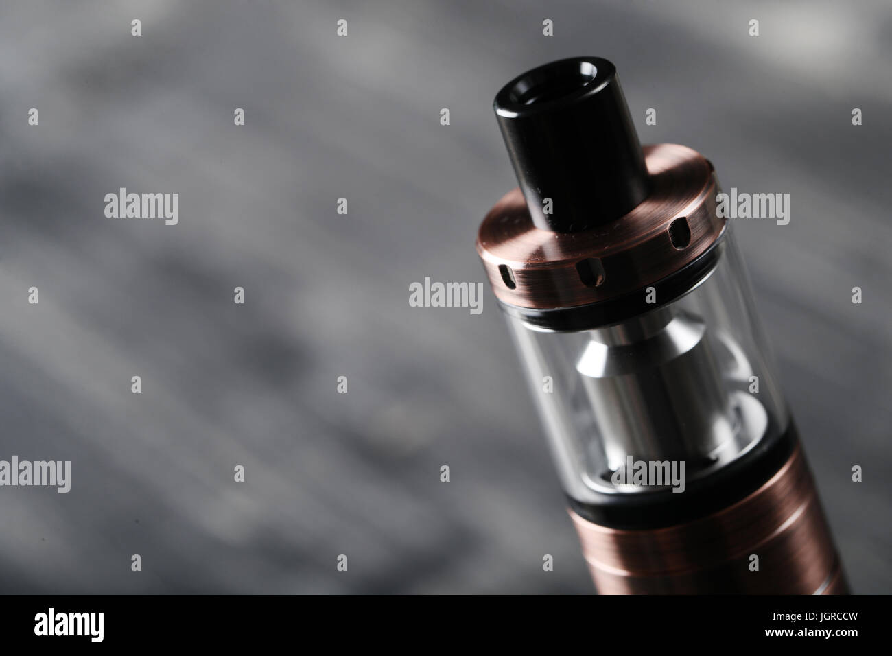 Vaping device on the wooden table Stock Photo - Alamy