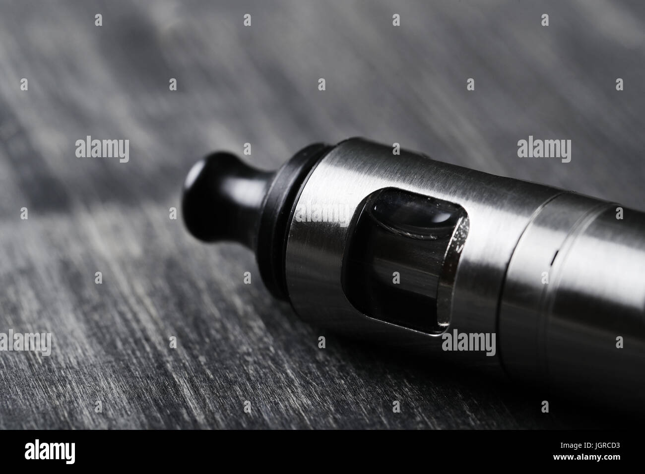 Vaping device on the wooden table Stock Photo - Alamy