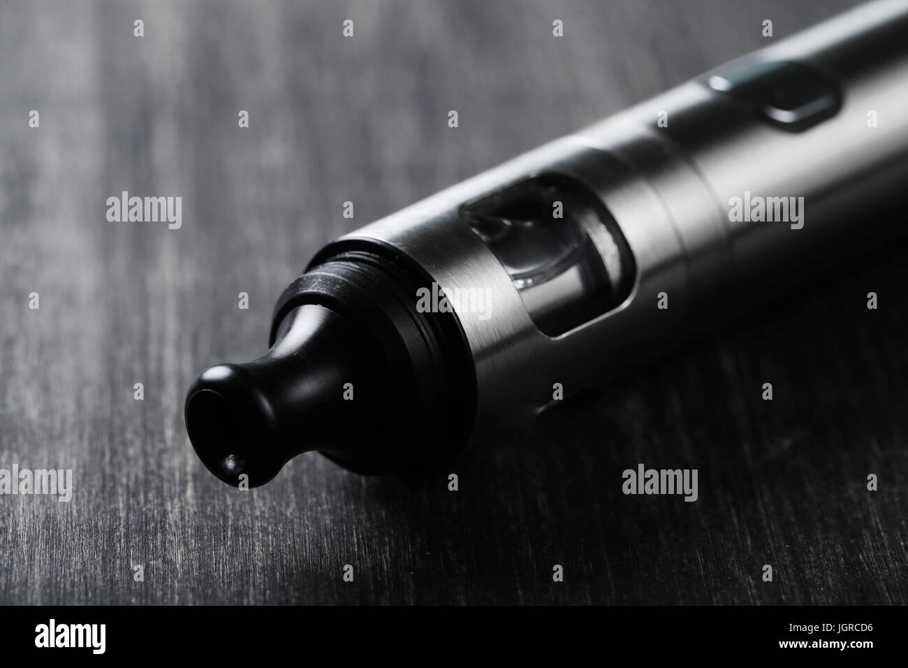 Vaping device on the wooden table Stock Photo - Alamy