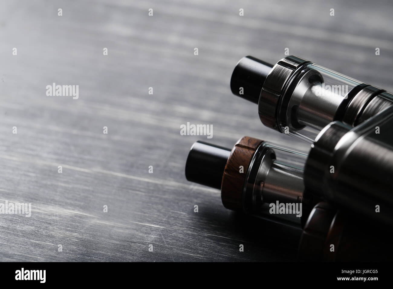 Vaping device on the wooden table Stock Photo - Alamy