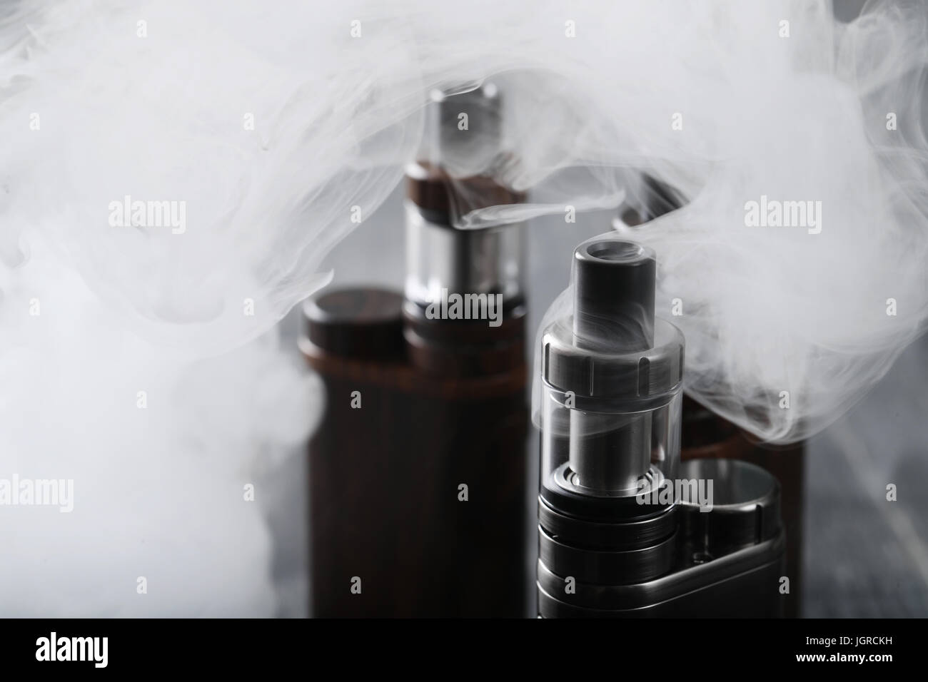 Vaping device on the wooden table Stock Photo - Alamy