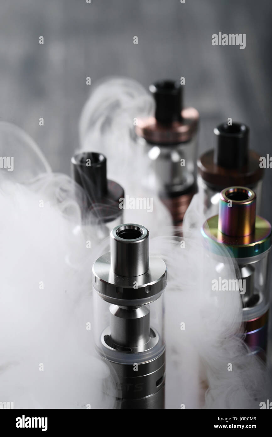 Vaping device on the wooden table Stock Photo - Alamy