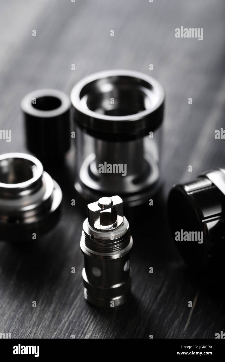 Vaping device on the wooden table Stock Photo - Alamy