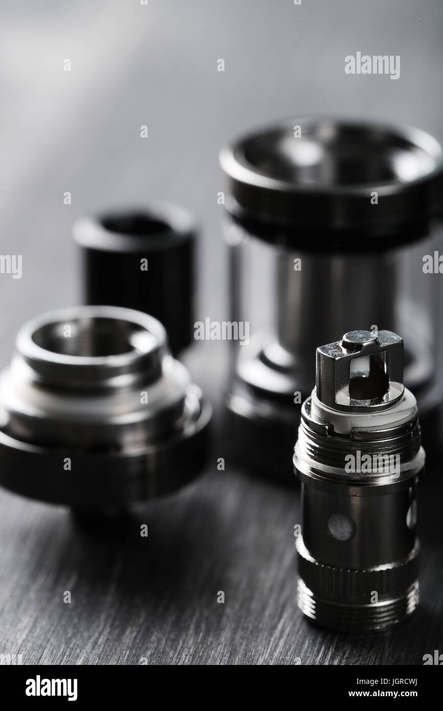 Vaping device on the wooden table Stock Photo - Alamy