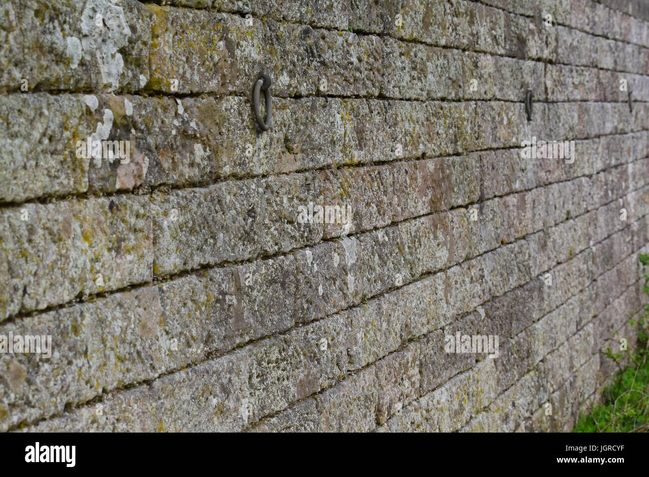 Tethers in a wall Stock Photo - Alamy