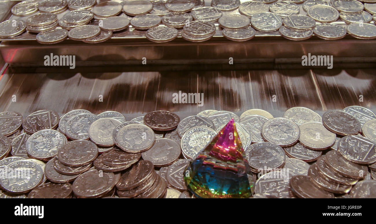 Old fashioned arcade money coin pushing machine Stock Photo - Alamy