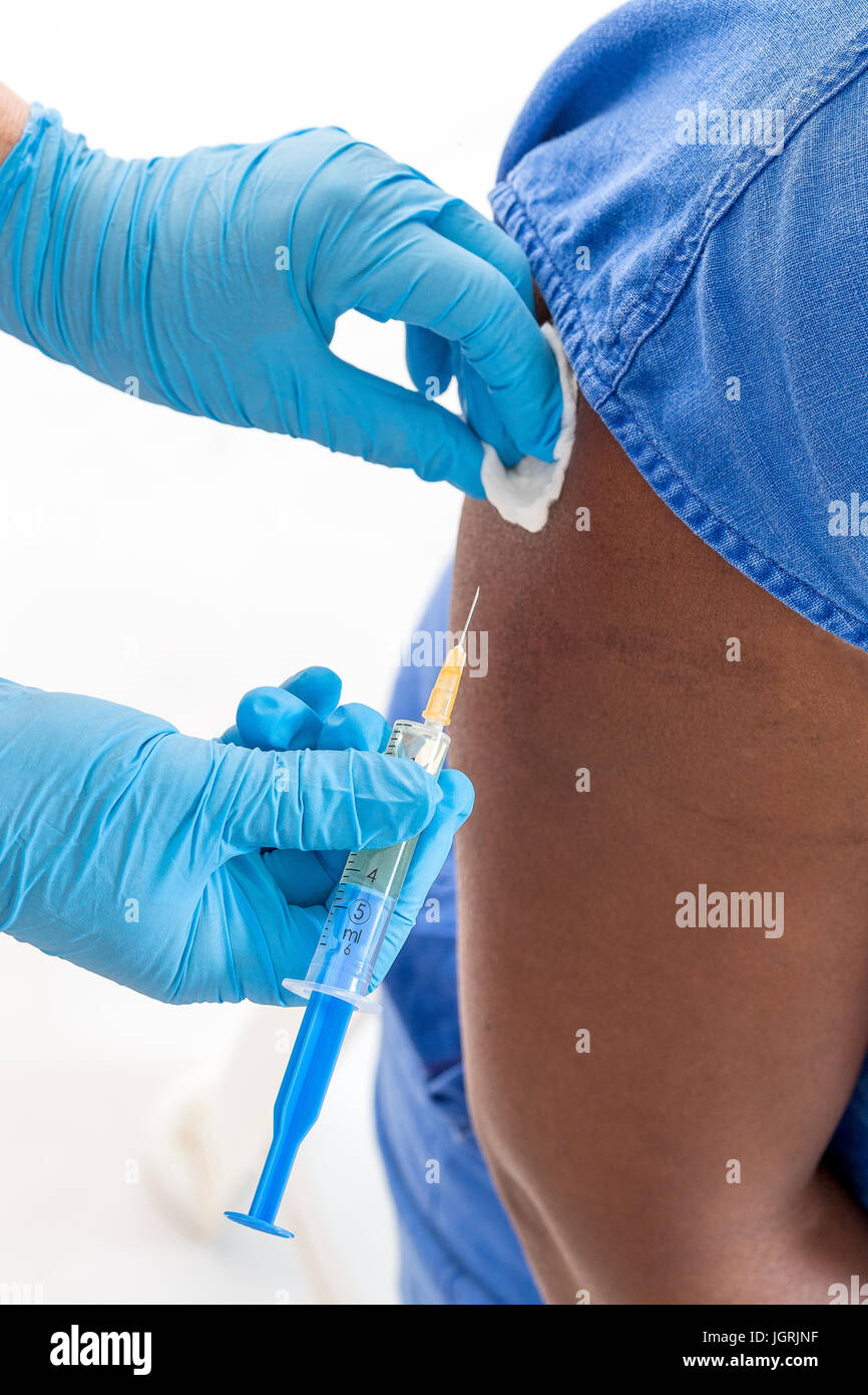 Doctor or Nurse holding a syringe give an injection, on white ...