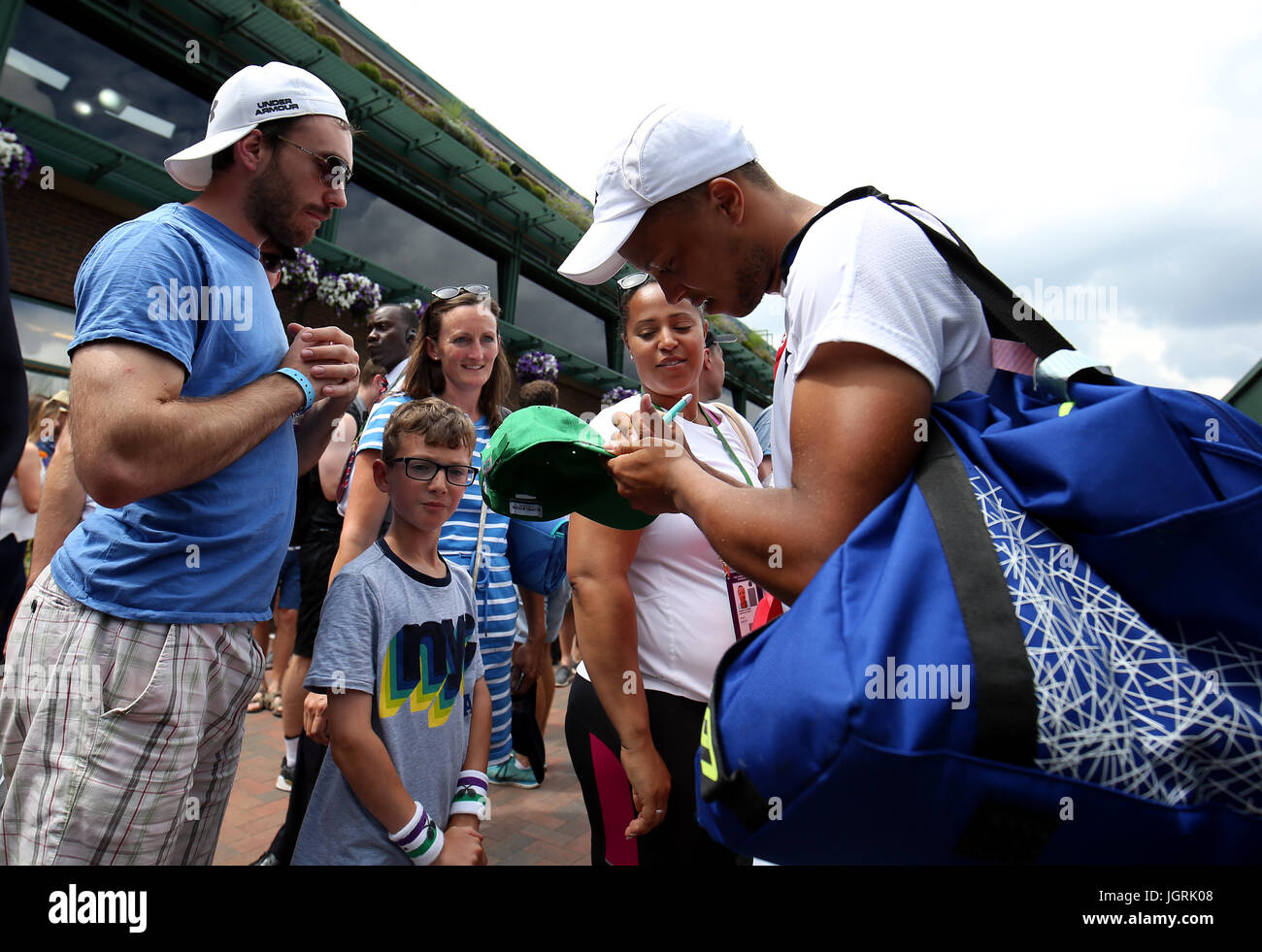 Jay Clarke signs autographs for fans after his doubles match with ...