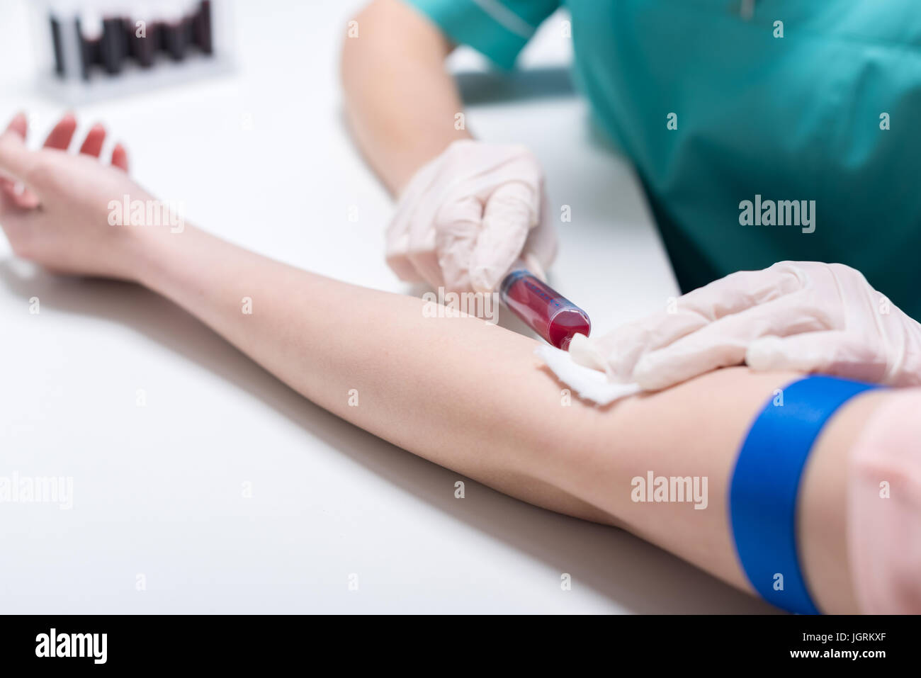 cropped shot of nurse taking blood sample of patient with syringe Stock ...