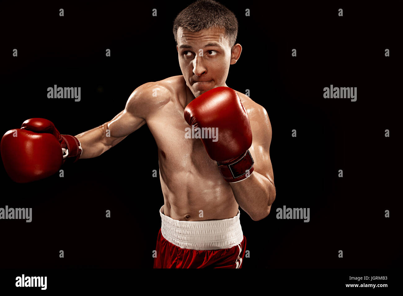 Male boxer boxing with dramatic edgy lighting in a dark studio Stock ...