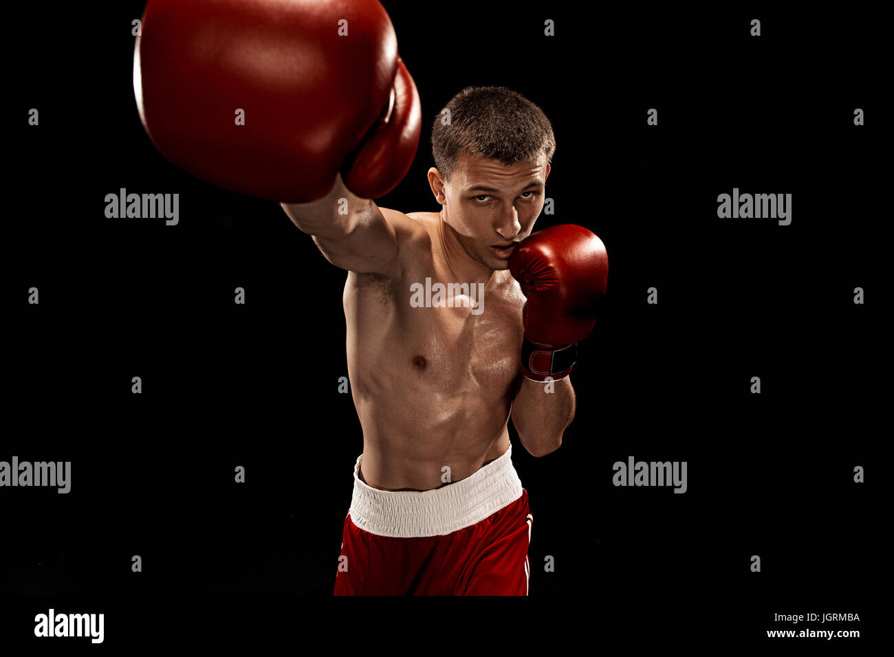 Male boxer boxing with dramatic edgy lighting in a dark studio Stock ...