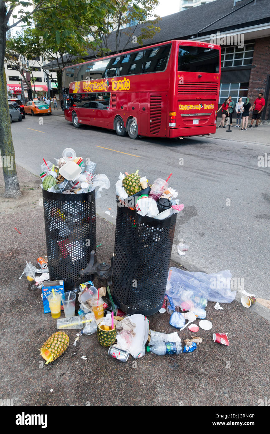 Overflowing garbage cans hi-res stock photography and images - Alamy