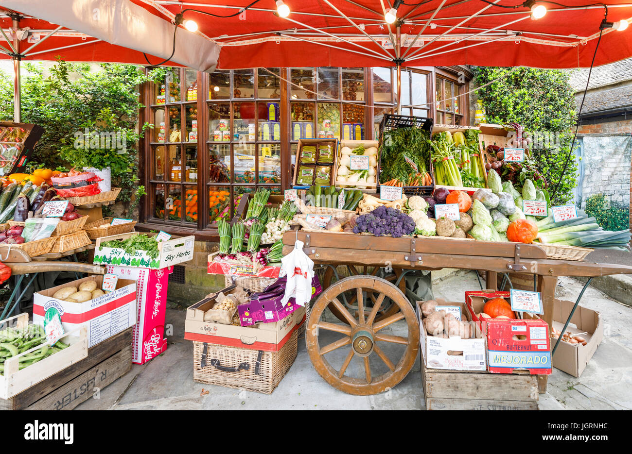 Colourful vegetable barrow display outside greengrocers shop, Broadway ...