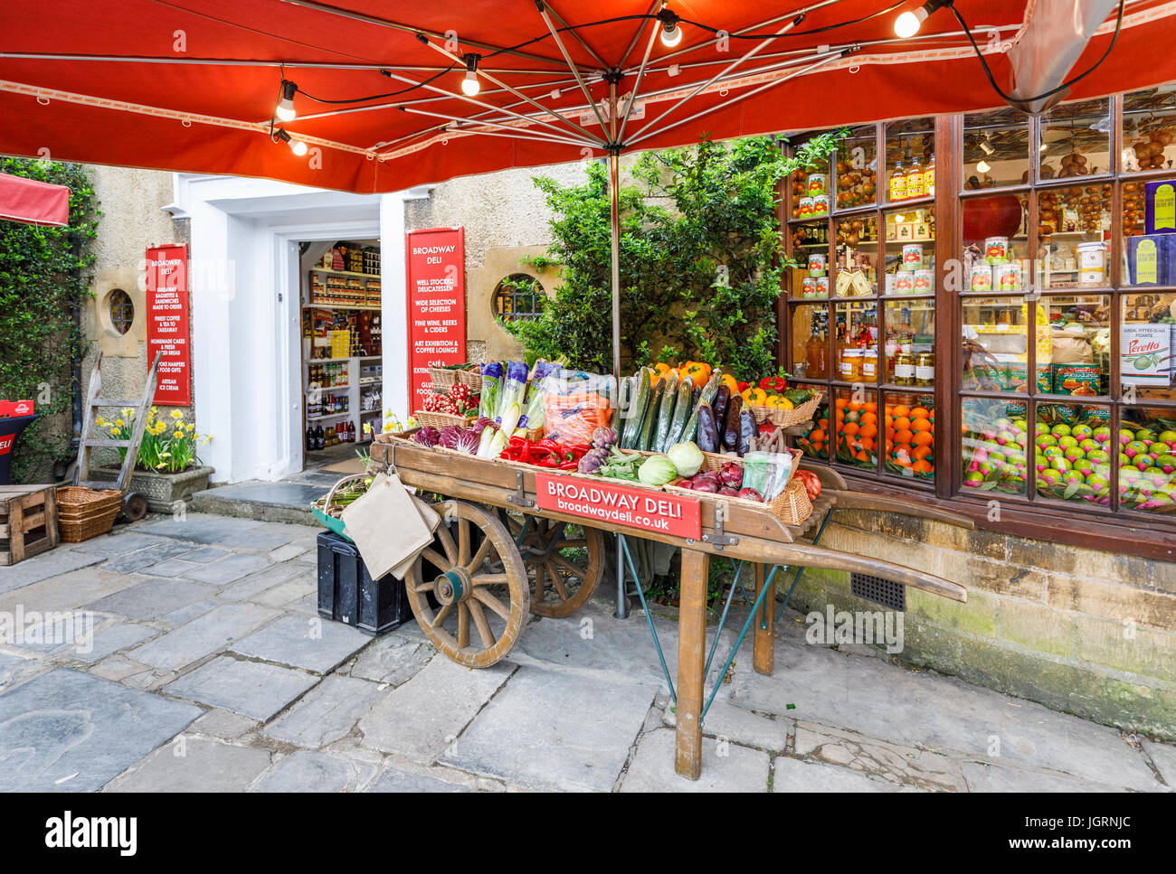 Colourful fruit barrow display outside greengrocers shop, Broadway ...