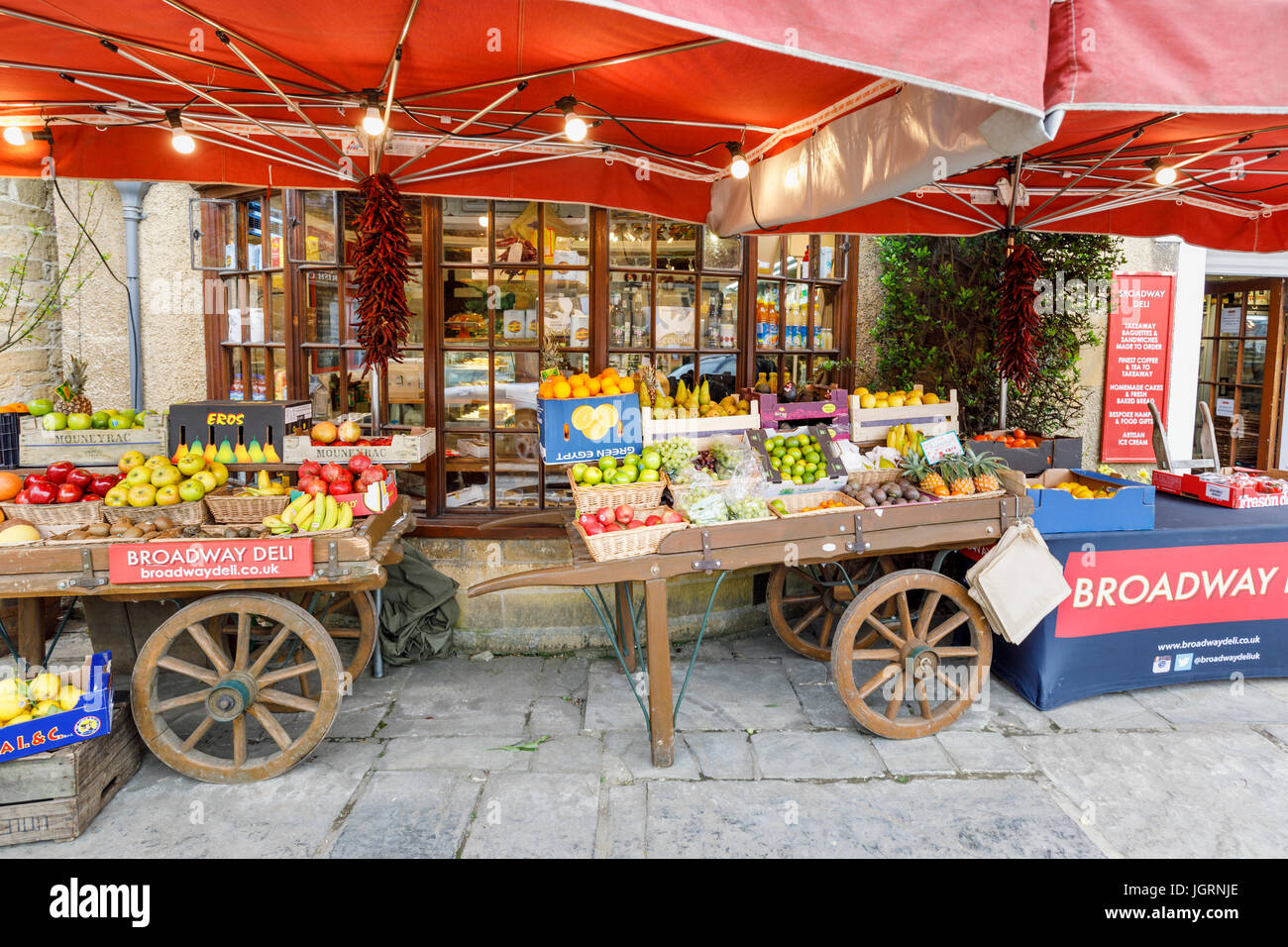 Colourful fruit barrow display outside greengrocers shop, Broadway ...