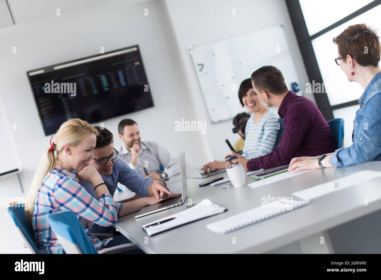 two business people using laptop preparing for next meeting and ...